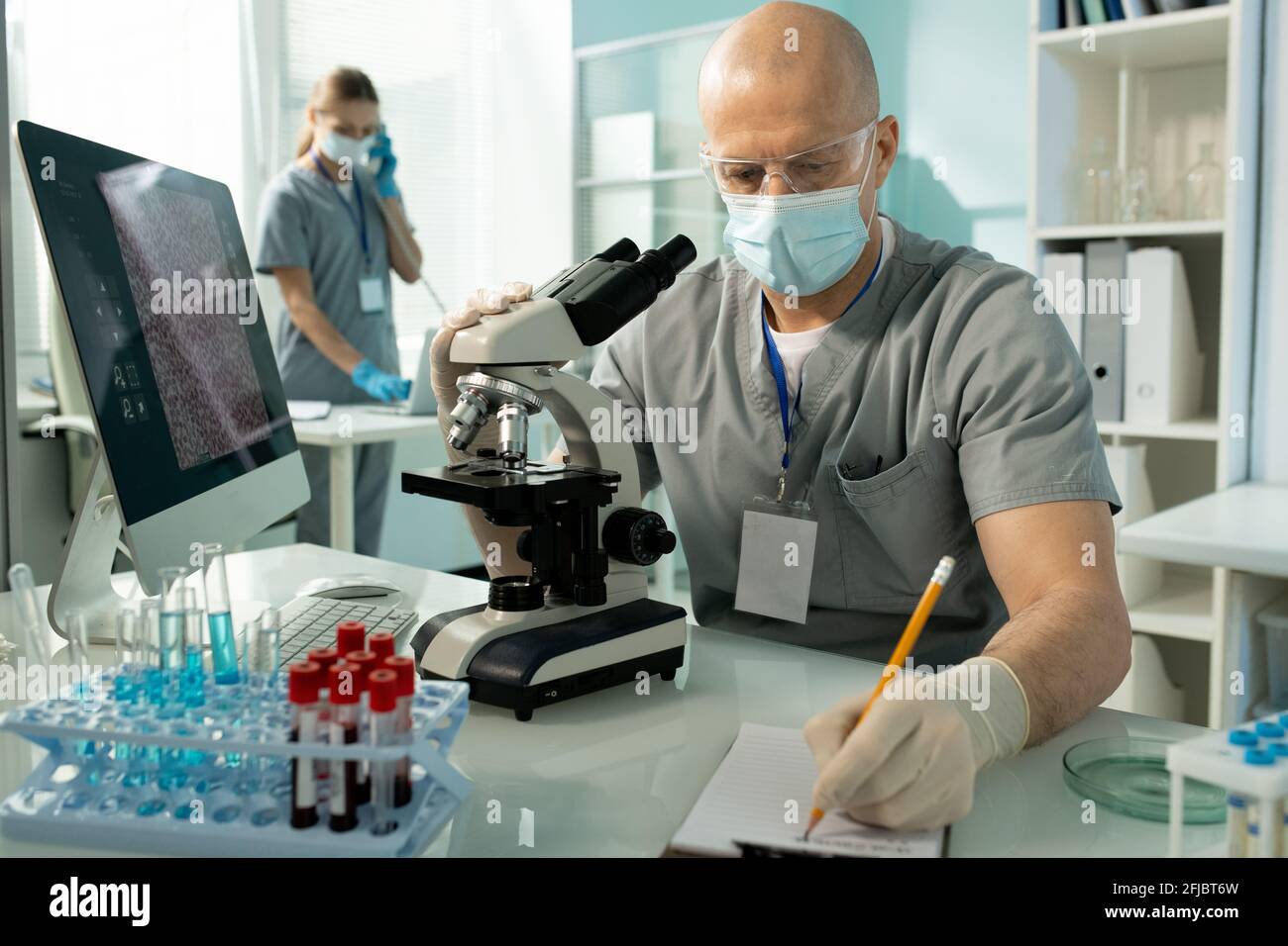 Biology student making notes hi-res stock photography and images - Alamy