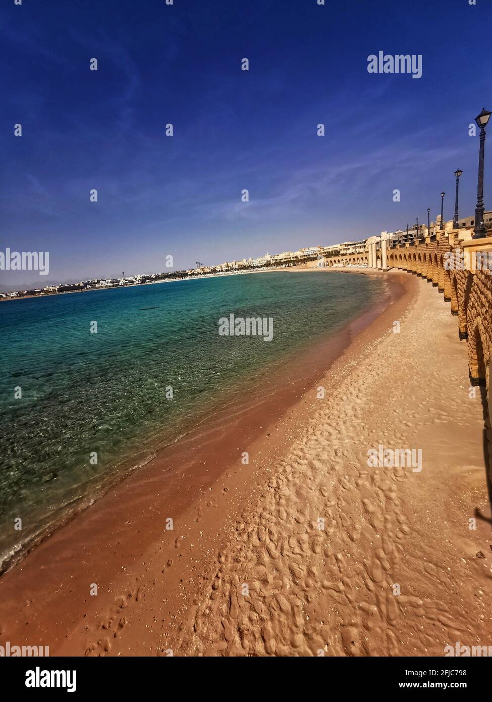 A beautiful view of a sandy seashore with infrastructure in Hurgada ...
