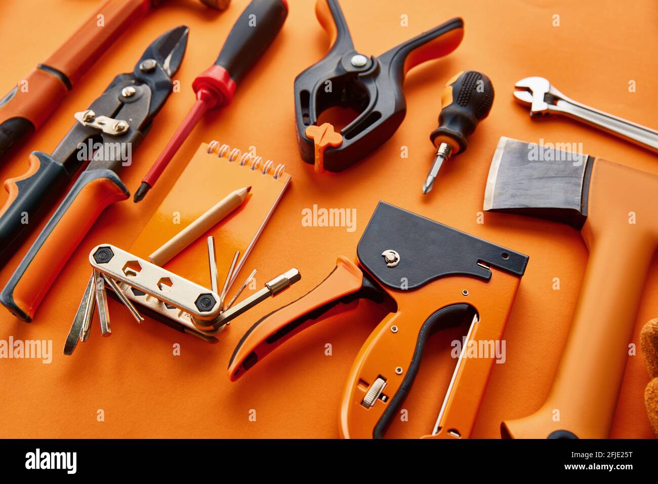 Professional workshop instrument, red background Stock Photo - Alamy