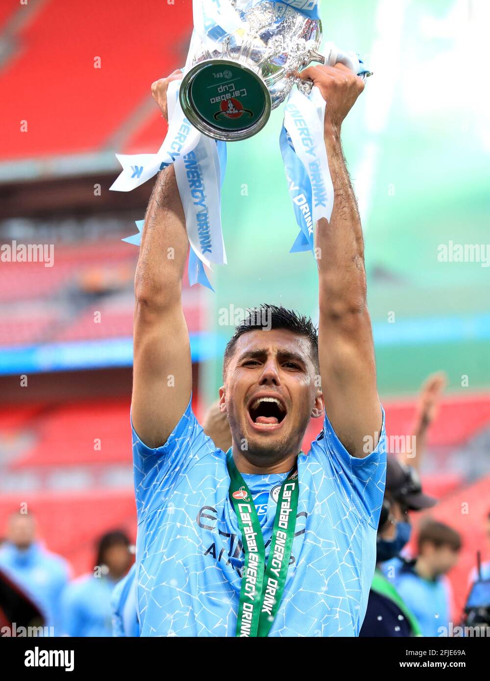 Manchester City's Rodri celebrates with the trophy after winning the ...