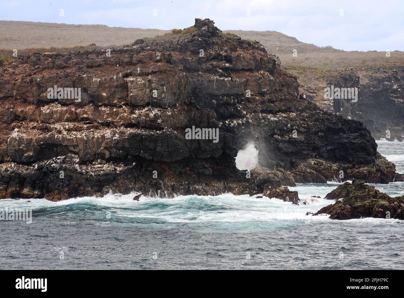 marine scene, seascape, water crashing; black lava; island's edge ...