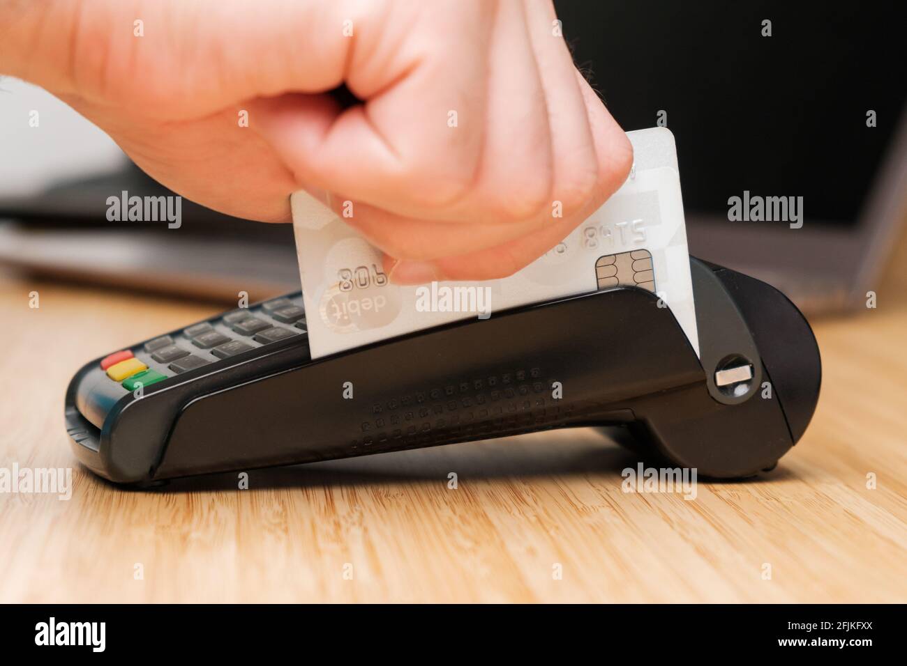 Close up man hand swiping credit card using POS terminal for payment ...