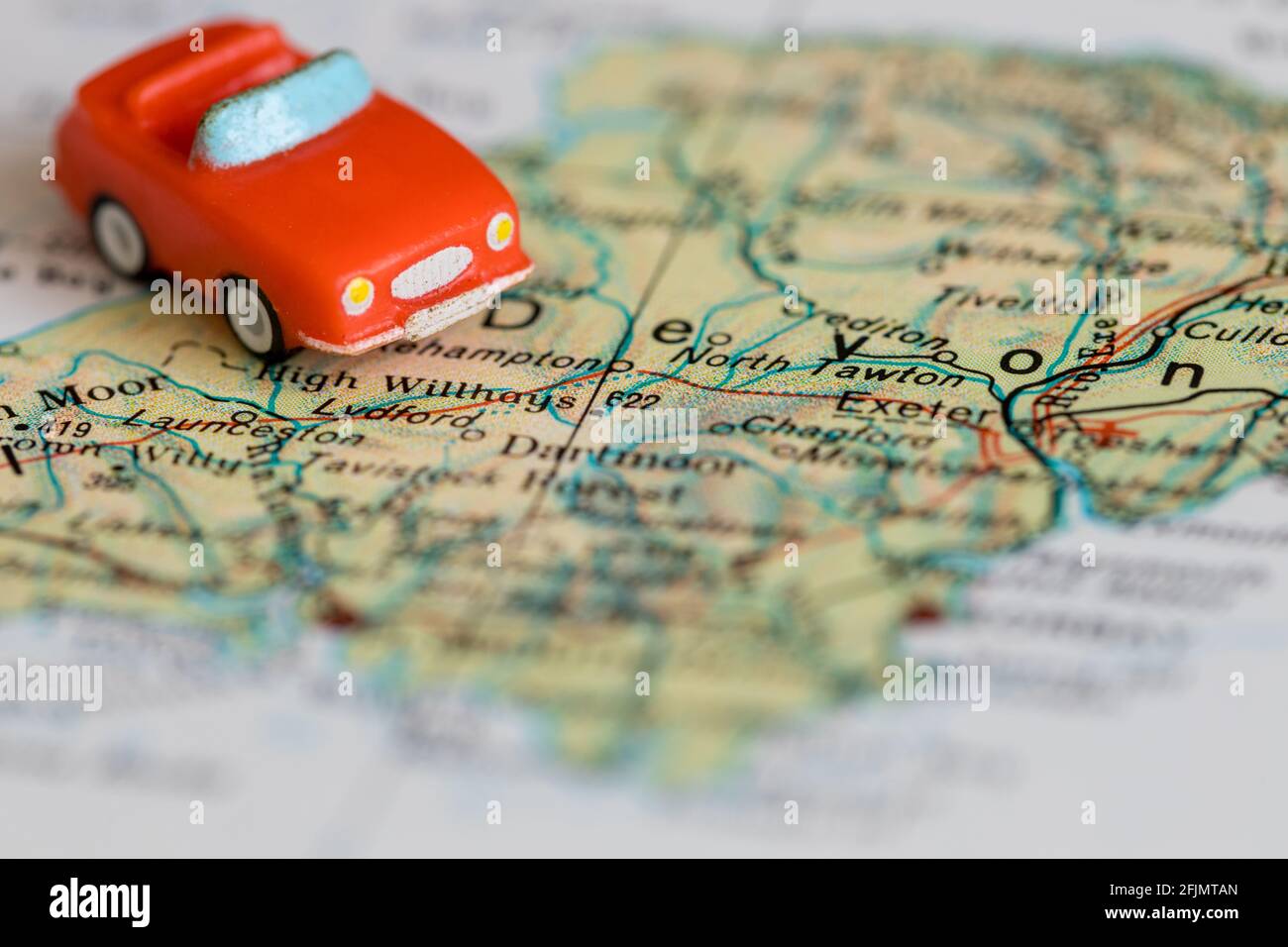 miniature car on the map. Country travel concept Stock Photo - Alamy