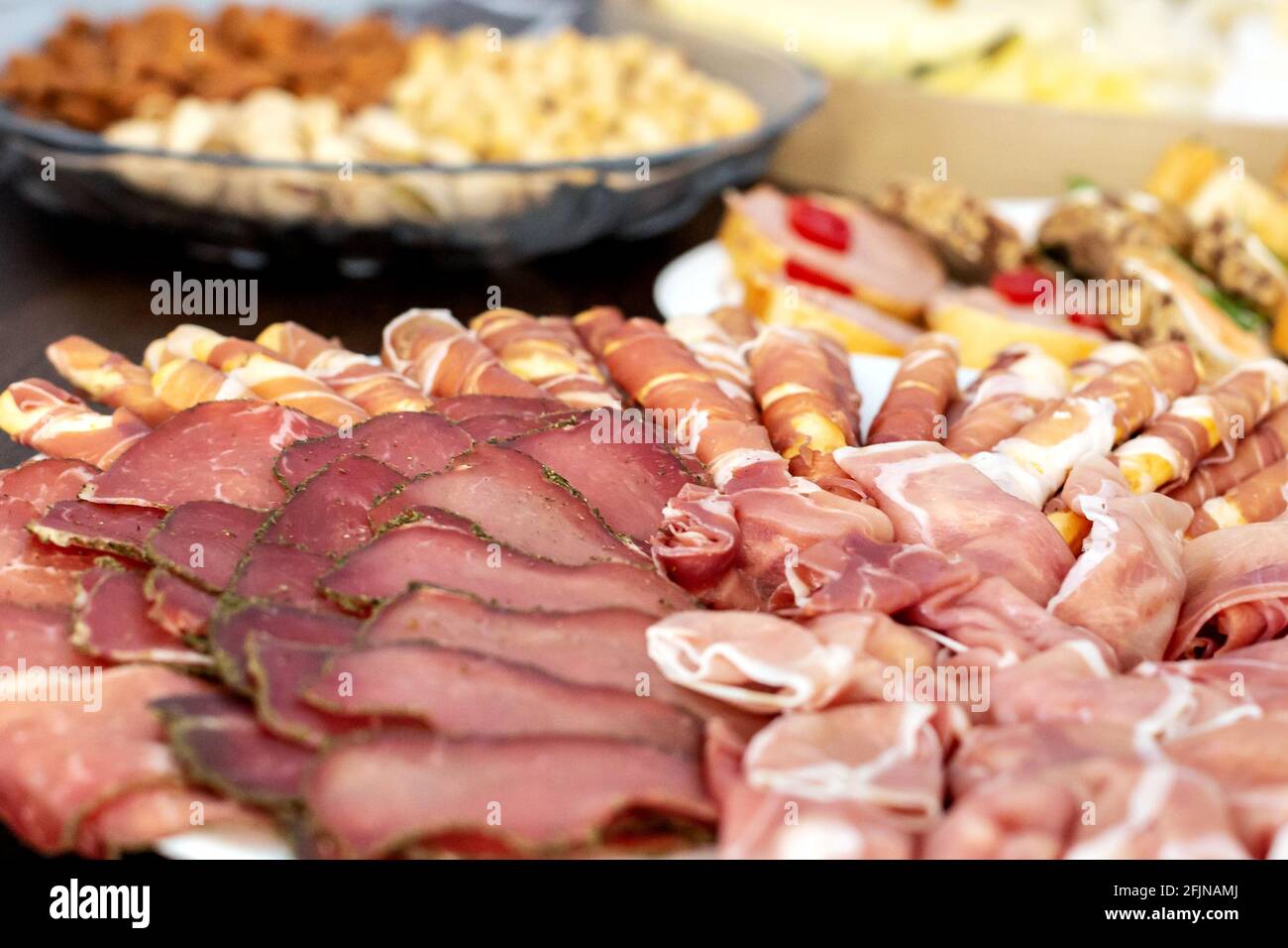 Assorted cold meats on a plate ready to eat Stock Photo - Alamy