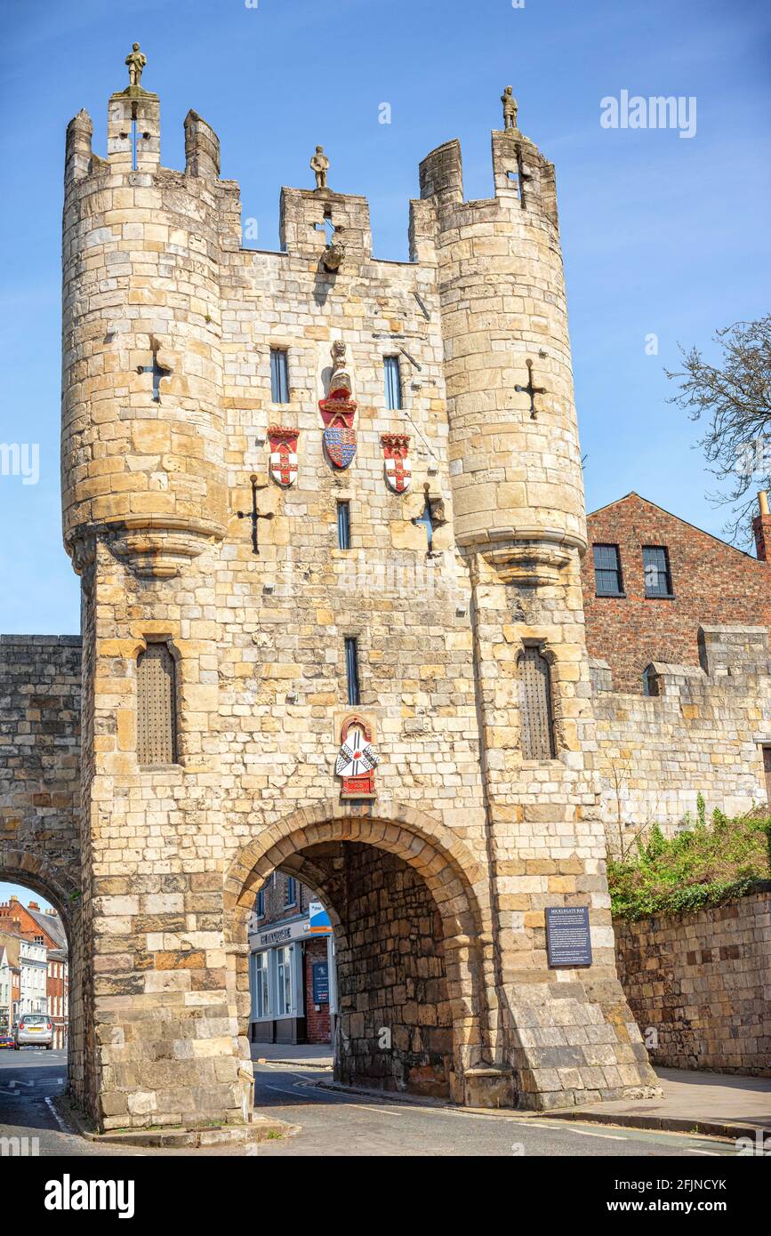 Medieval architecture of an ancient city gateway. Twin towers are above ...