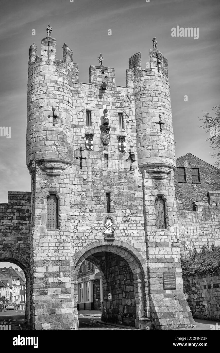 Medieval architecture of an ancient city gateway. Twin towers are above ...
