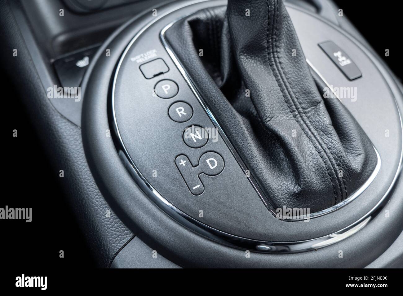 Automatic gear stick of a modern car. Modern car interior details ...