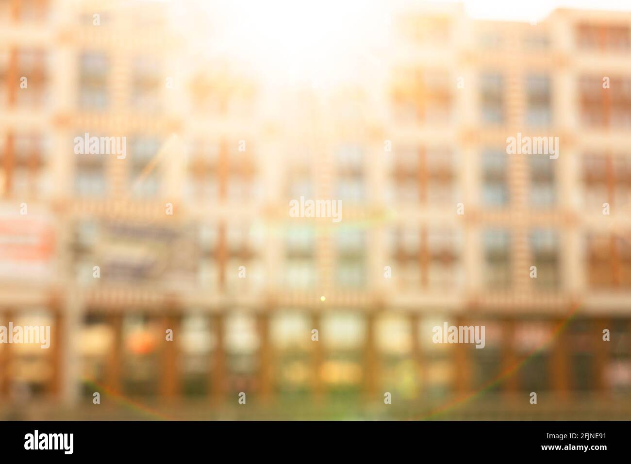 Abstract blurred building with illuminated facade exterior at the ...