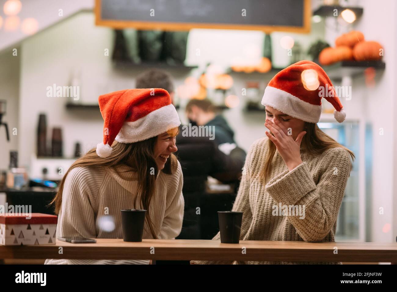 Portrait of happy cute young friends having fun in cafe Stock Photo - Alamy