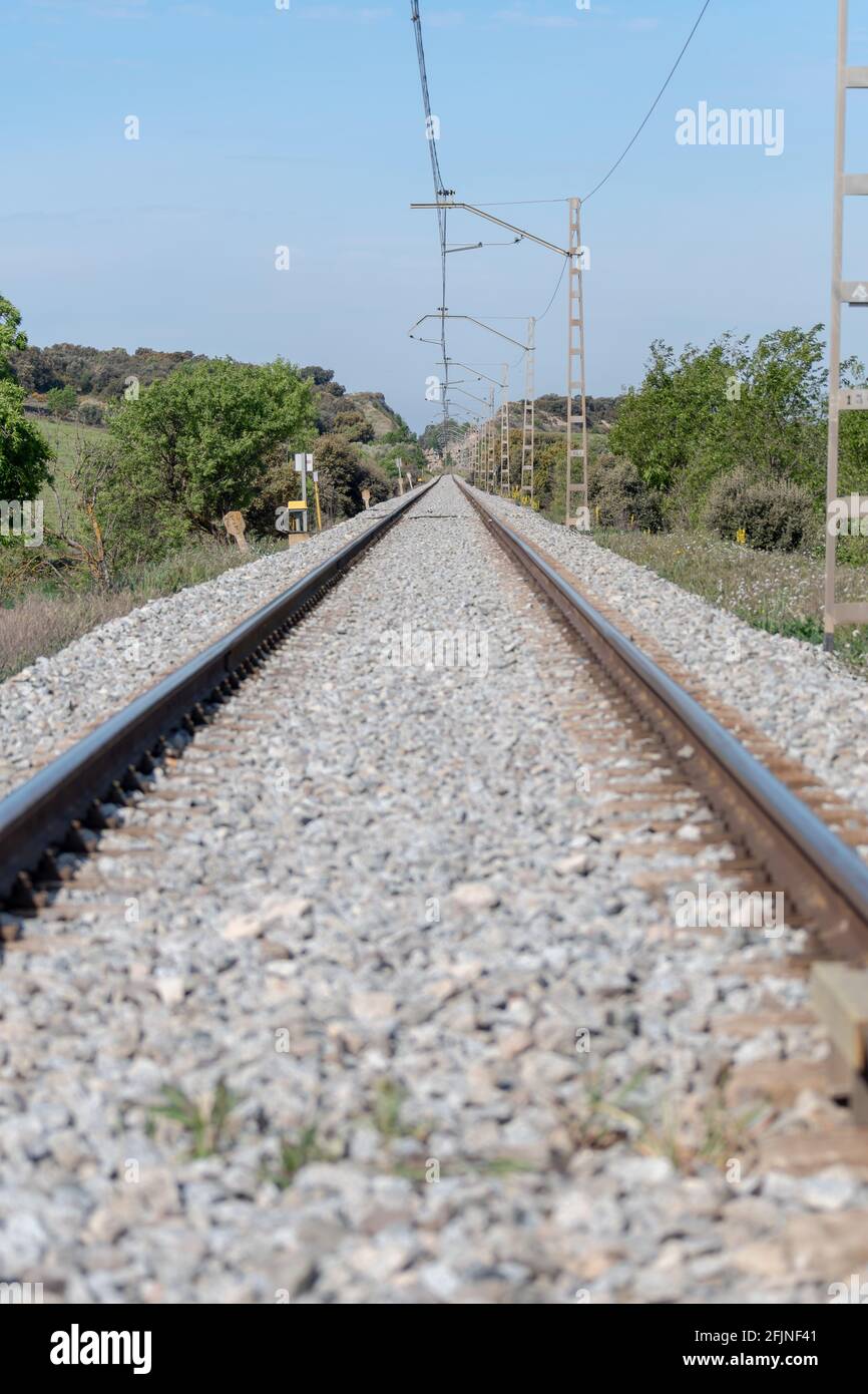 View of railroad rails with rails, catenary and crossbeams Stock Photo ...