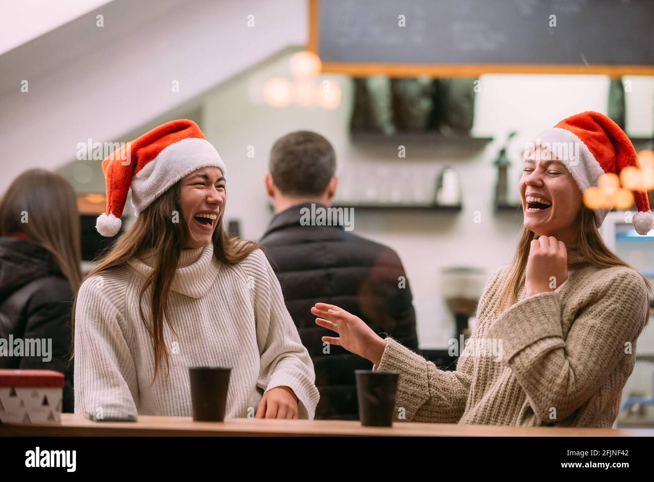 Portrait of happy cute young friends having fun in cafe Stock Photo - Alamy