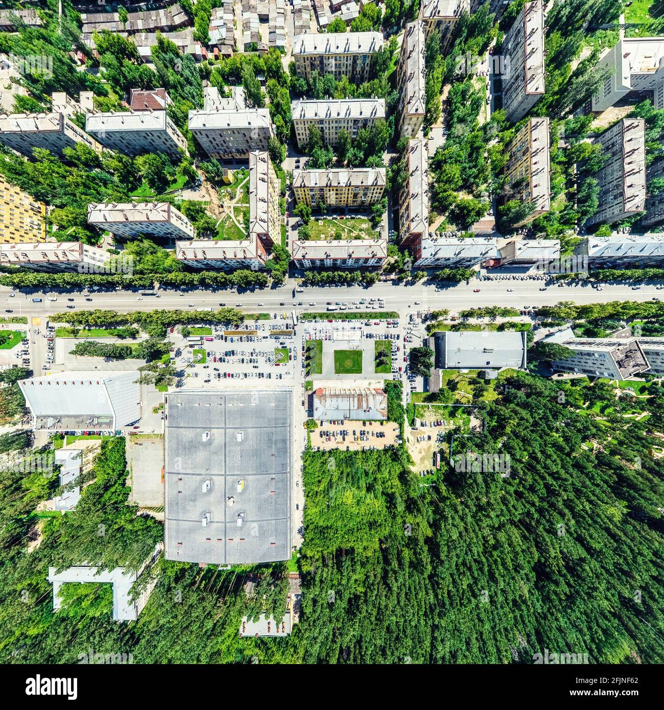 Aerial city view with crossroads and roads, houses, buildings, parks ...