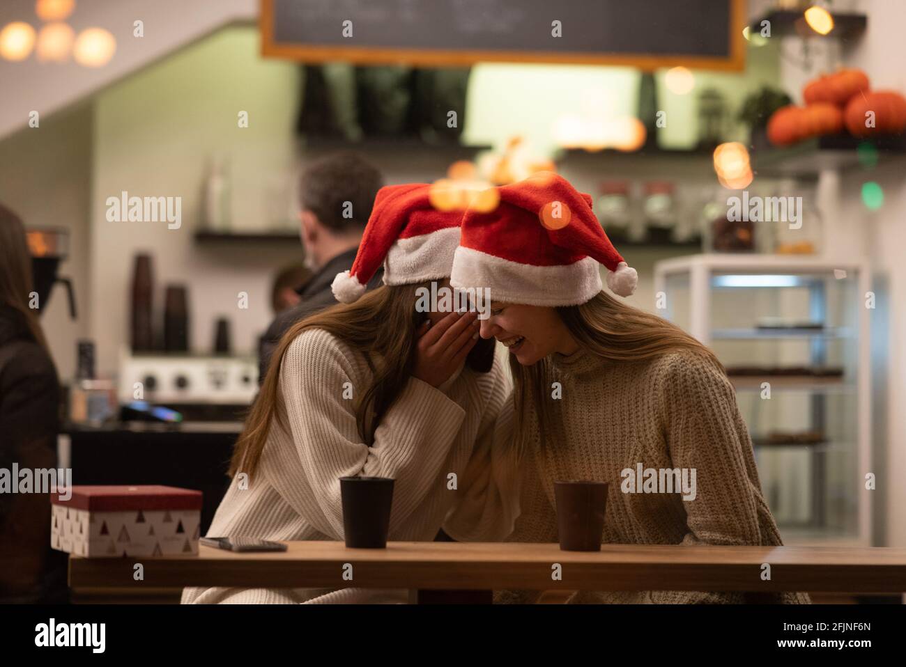Portrait of happy cute young friends having fun in cafe Stock Photo - Alamy