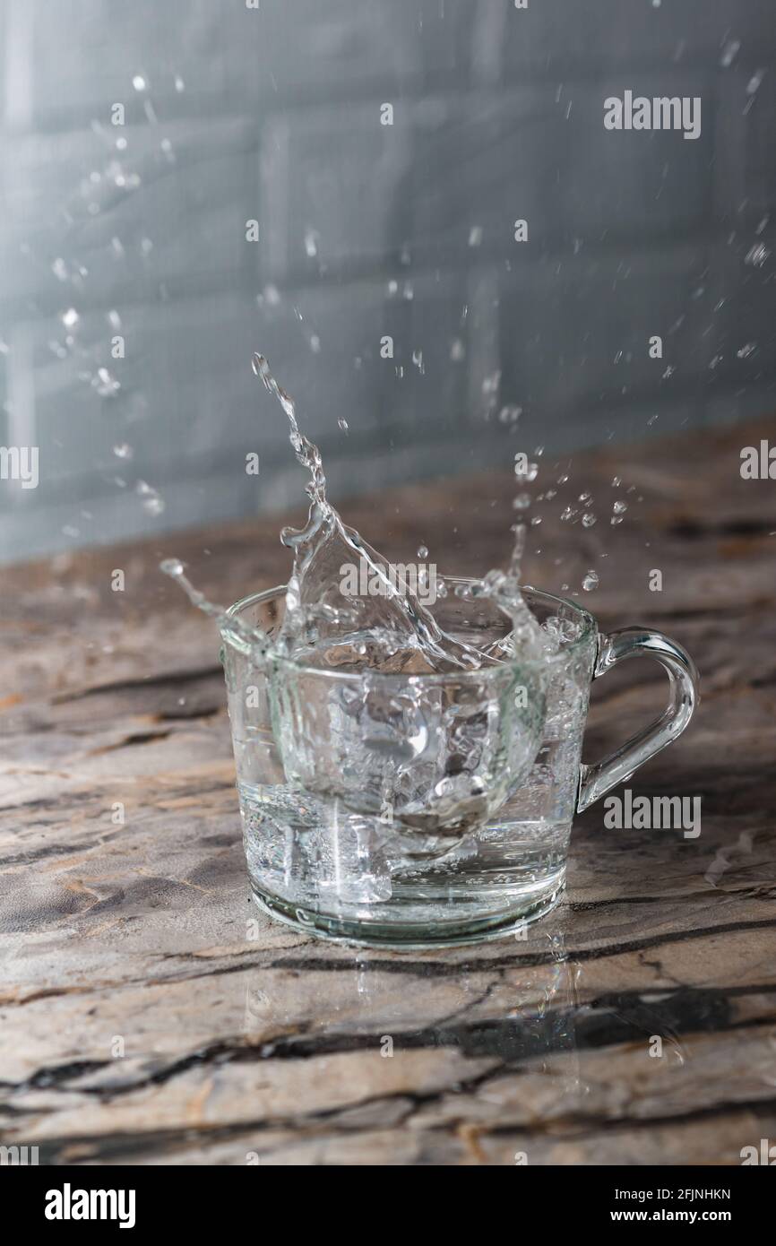 Ice drop with water splash hi-res stock photography and images - Alamy