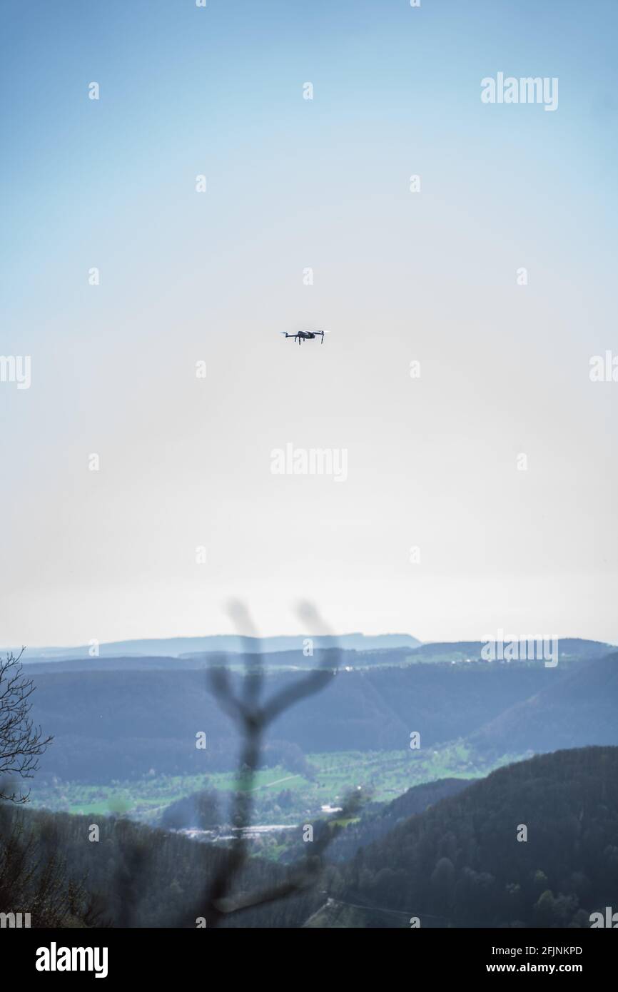 drone flying over a village near Stuttgart, Germany. Blue sky gives ...