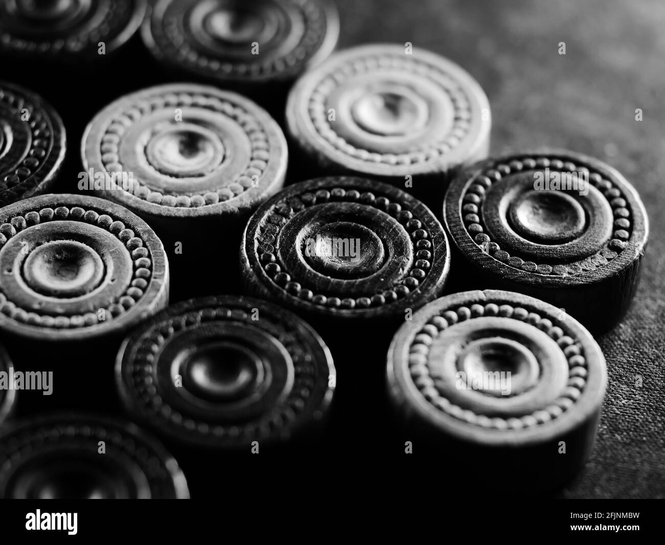 A grayscale shot of stacks of checkers pieces Stock Photo - Alamy