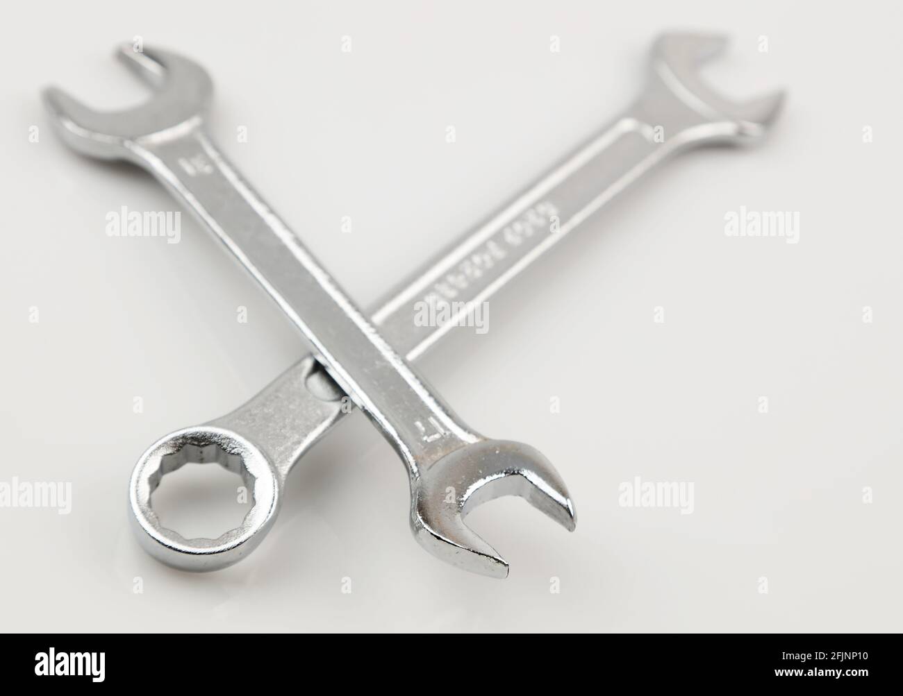 Two metal spanners on plain background Stock Photo - Alamy