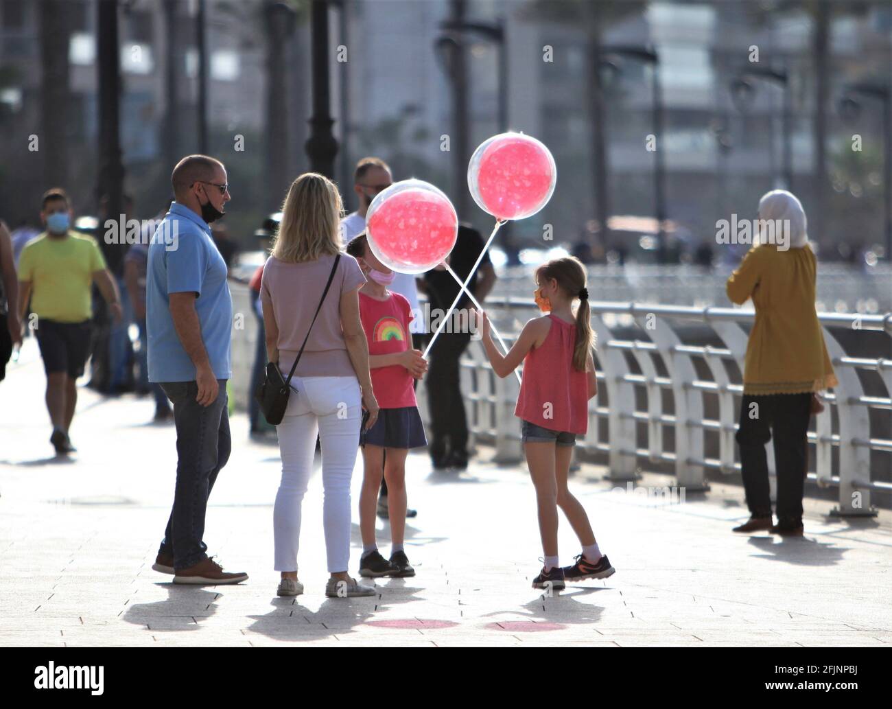 Beruit, Lebanon. 24th Apr, 2021. Two girls play with balloons at the ...