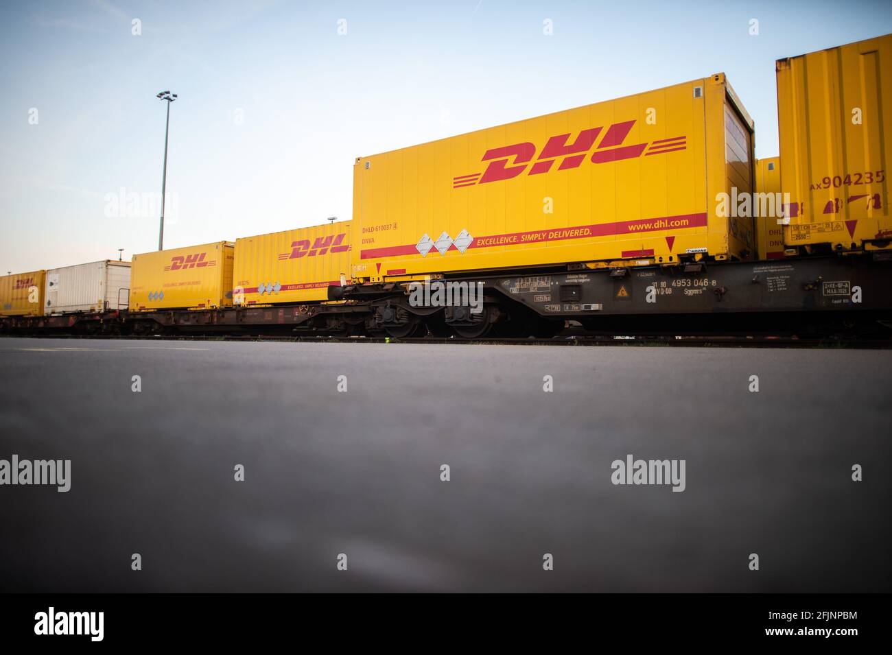 Wuppertal, Germany. 25th Apr, 2021. DHL containers stand on wagons at ...