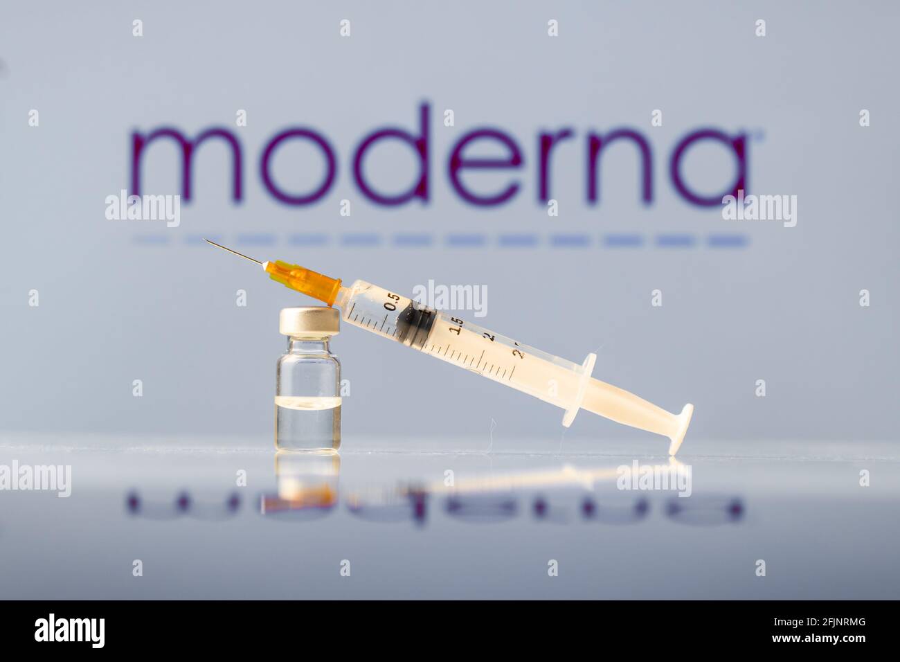 Moderna Coronavirus Vaccine vial and syringe with logo as background ...