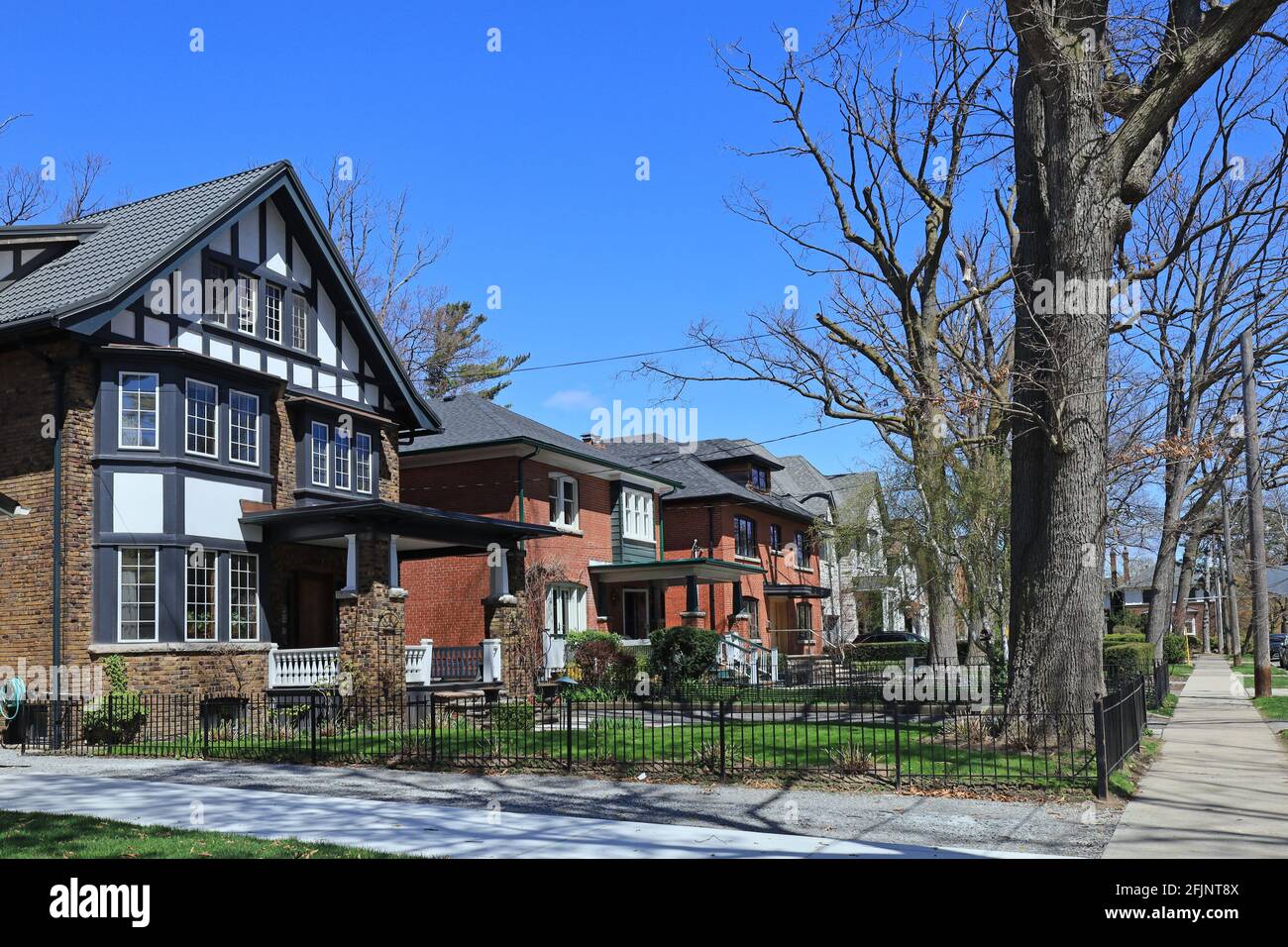 Middle class residential neighborhood with traditional detached houses ...