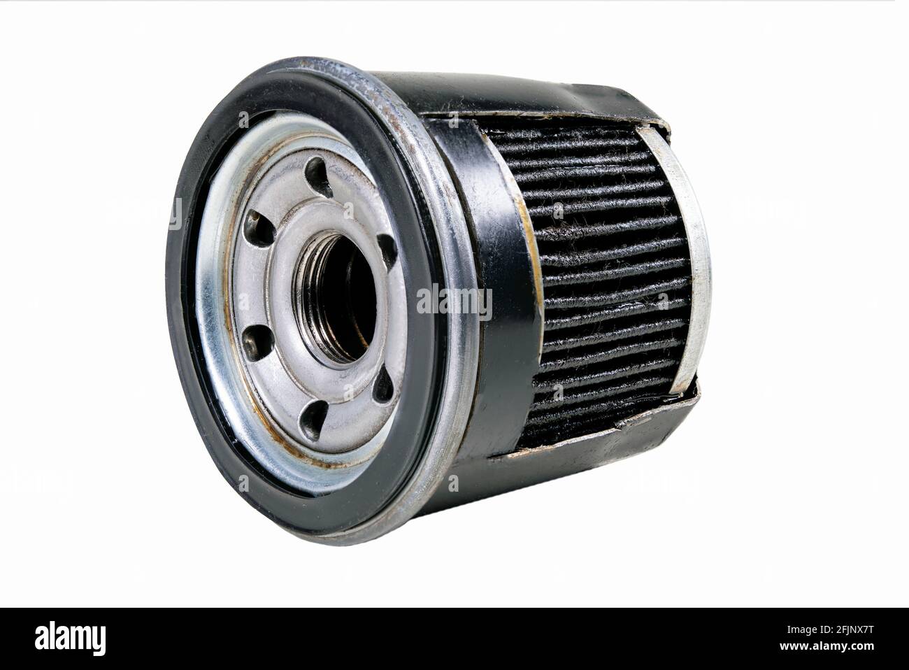 Dirty oil filter with cut metal coating. The interior of the engine oil ...