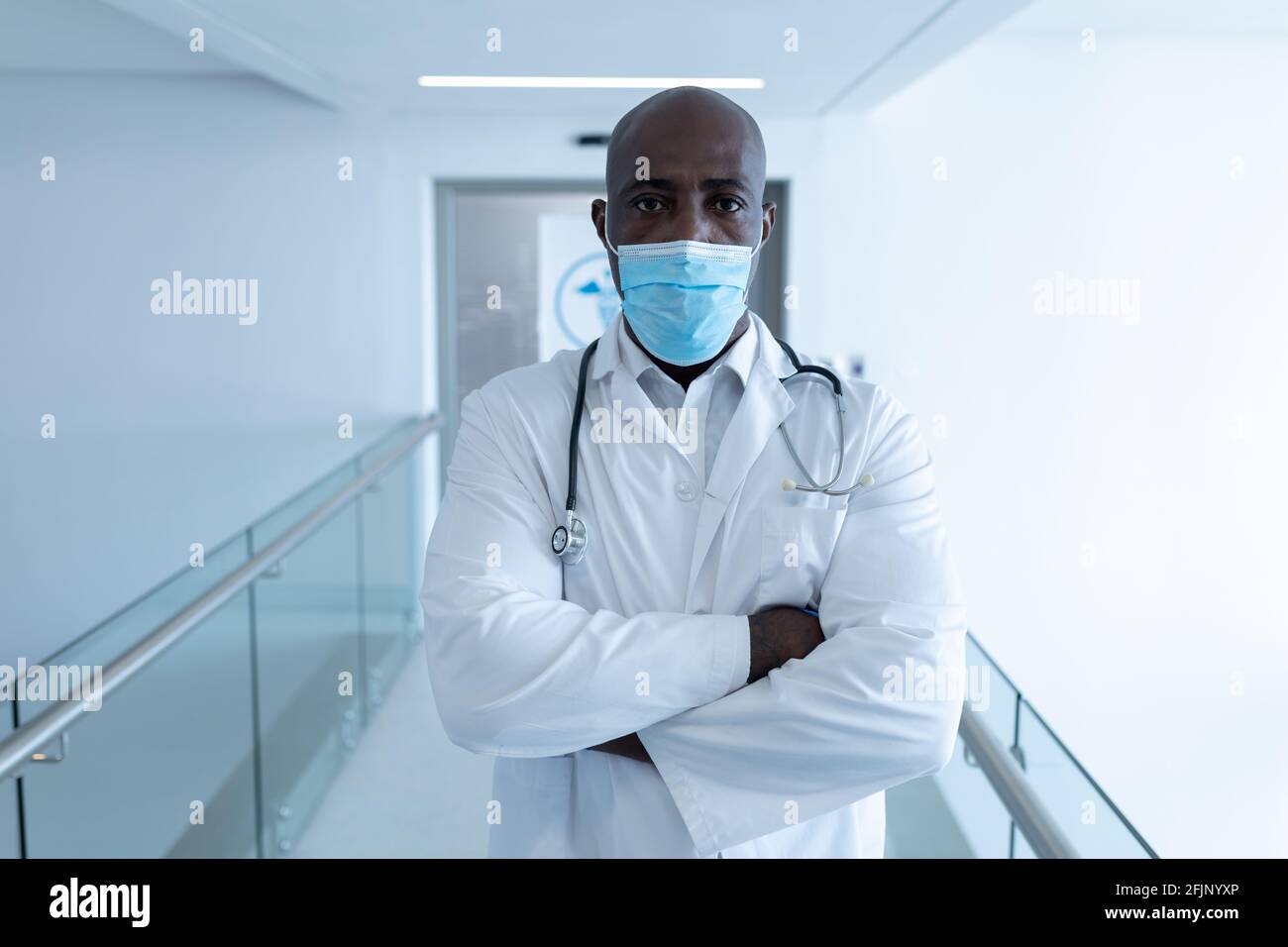 Doctor arms crossed african american hi-res stock photography and ...