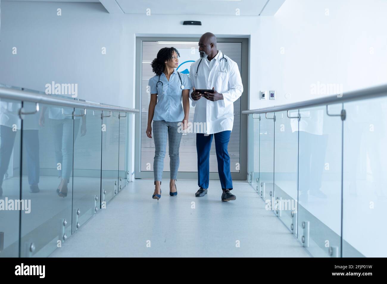 Doctor walking hospital hi-res stock photography and images - Alamy