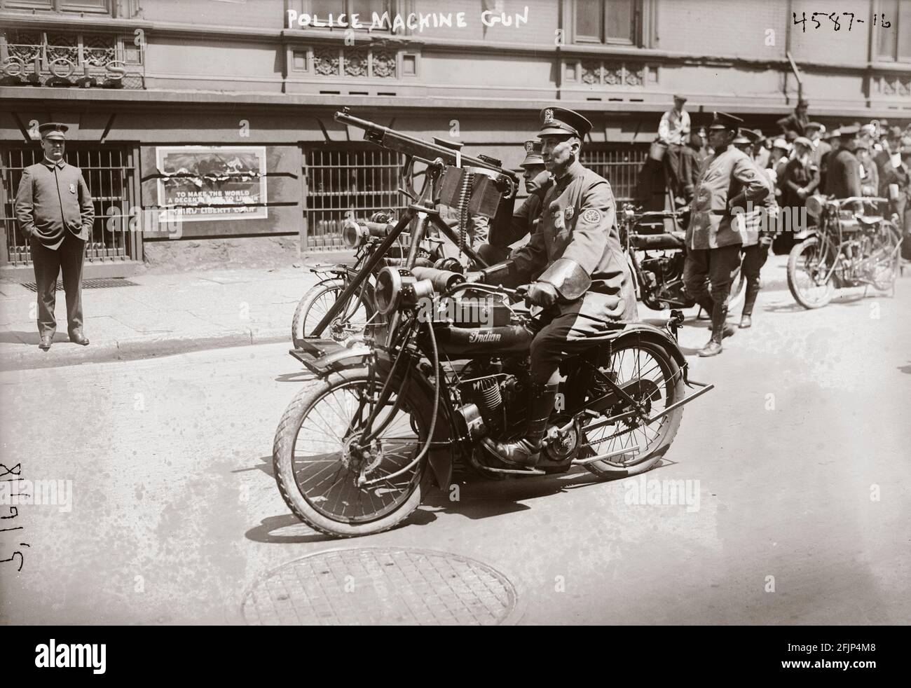 Police machine gun. Photograph shows a police officer riding a ...