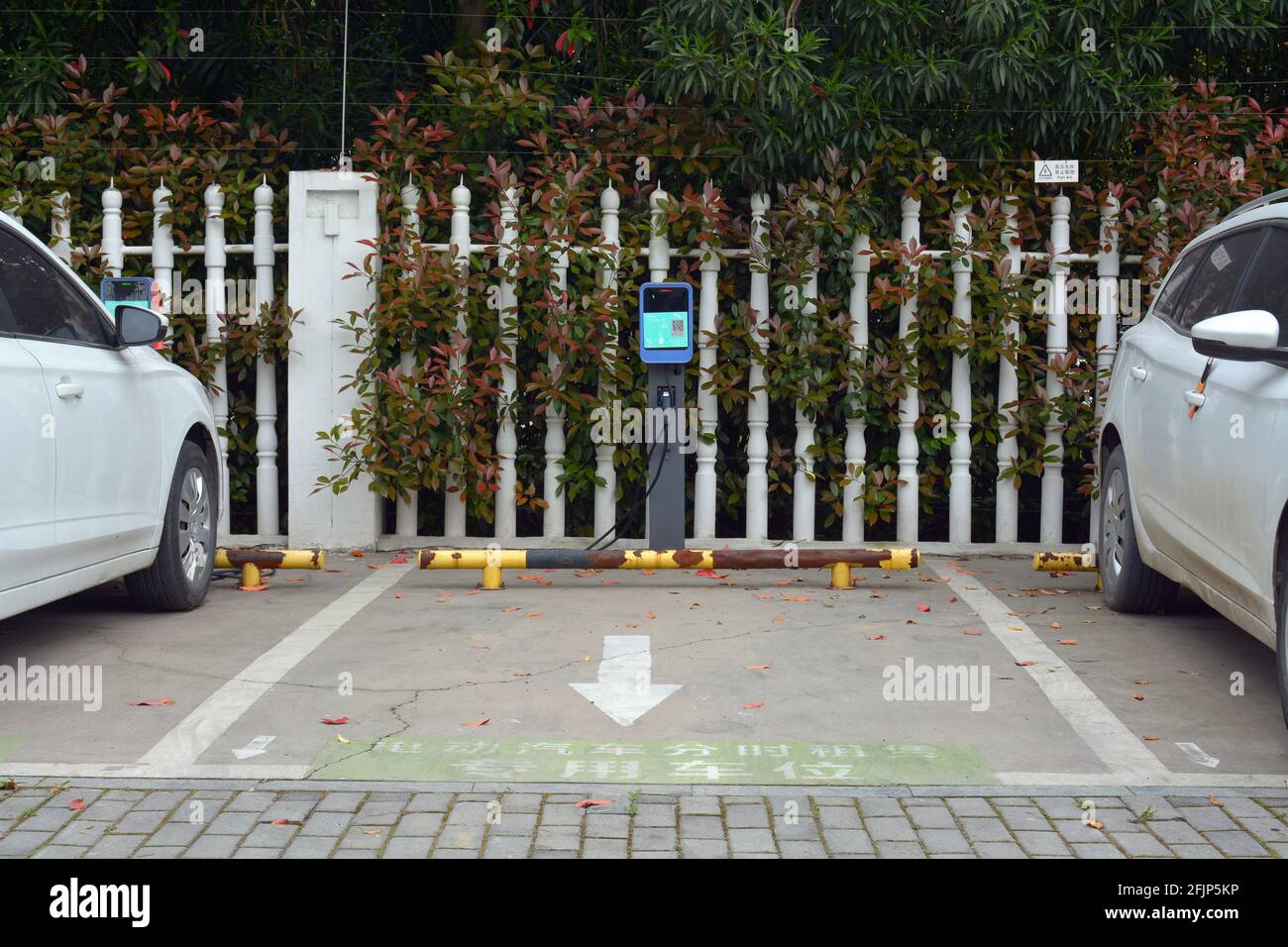 Charging port for electric cars to recharge on a Chinese street. QR ...