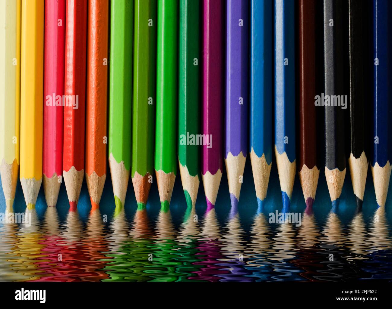 Crayons reflected in water, Germany Stock Photo - Alamy