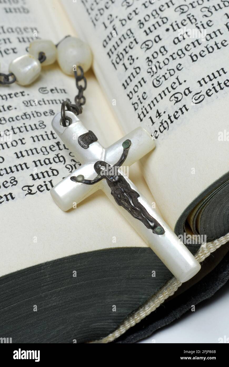 Rosary on bible, cross, crucifix, rosary chain Stock Photo - Alamy