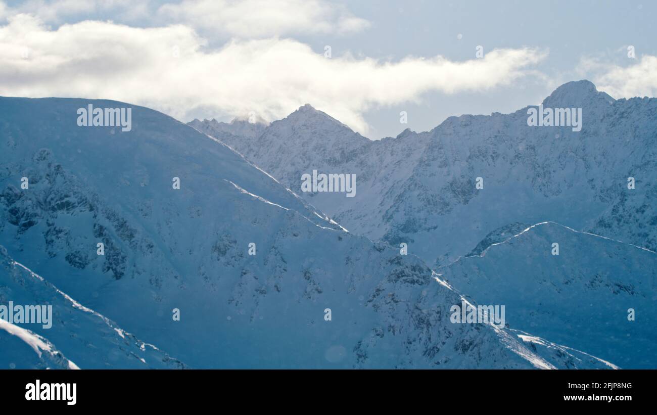 Beautiful View Of Snow-Capped Mountains Against Cloudy Sky - Foggy ...