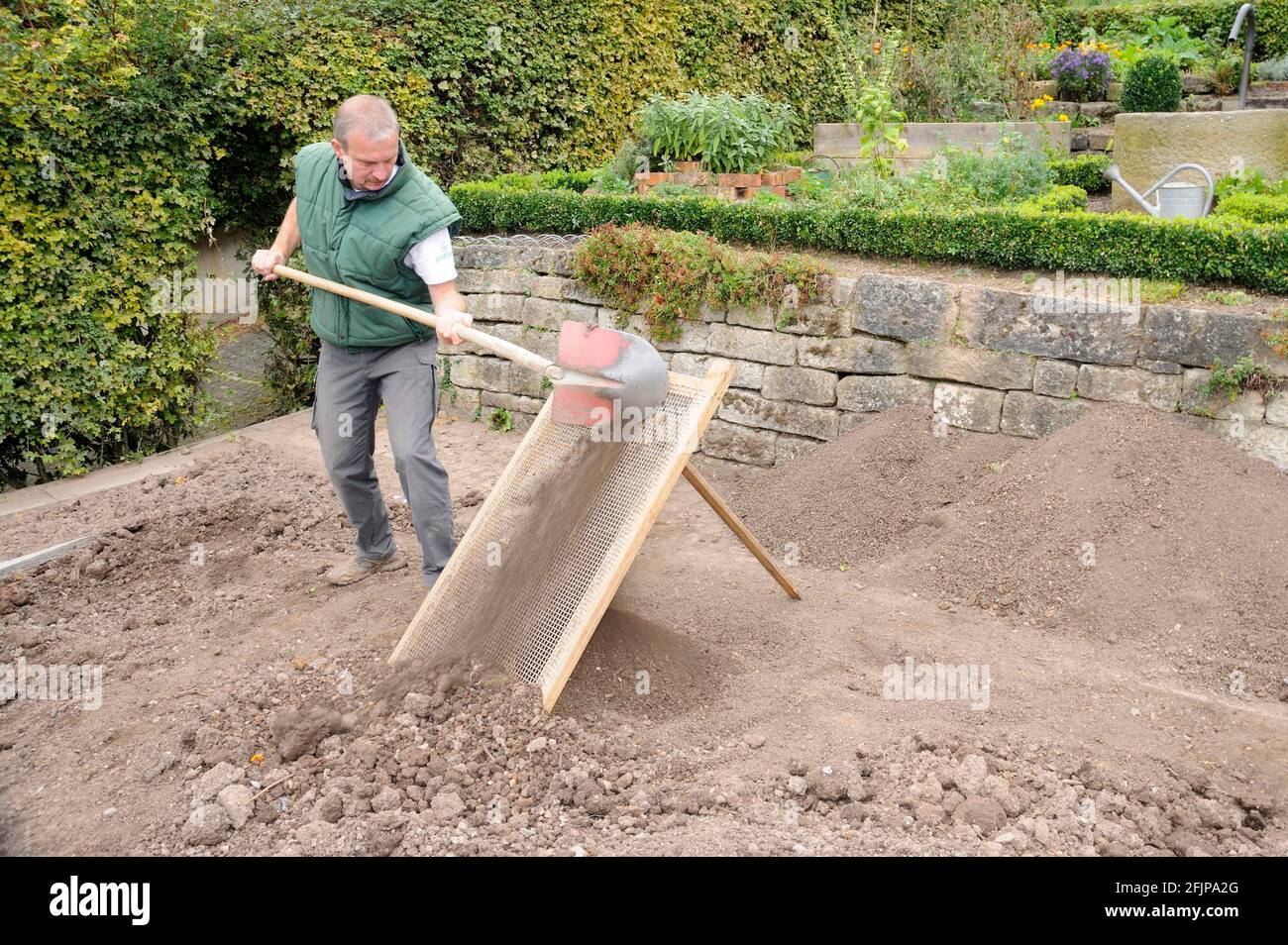 Sieving soil hi-res stock photography and images - Alamy