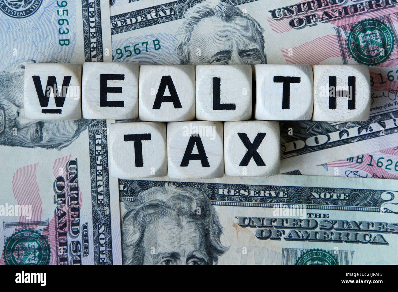 Wealthy tax signage on a background of American dollars Stock Photo - Alamy