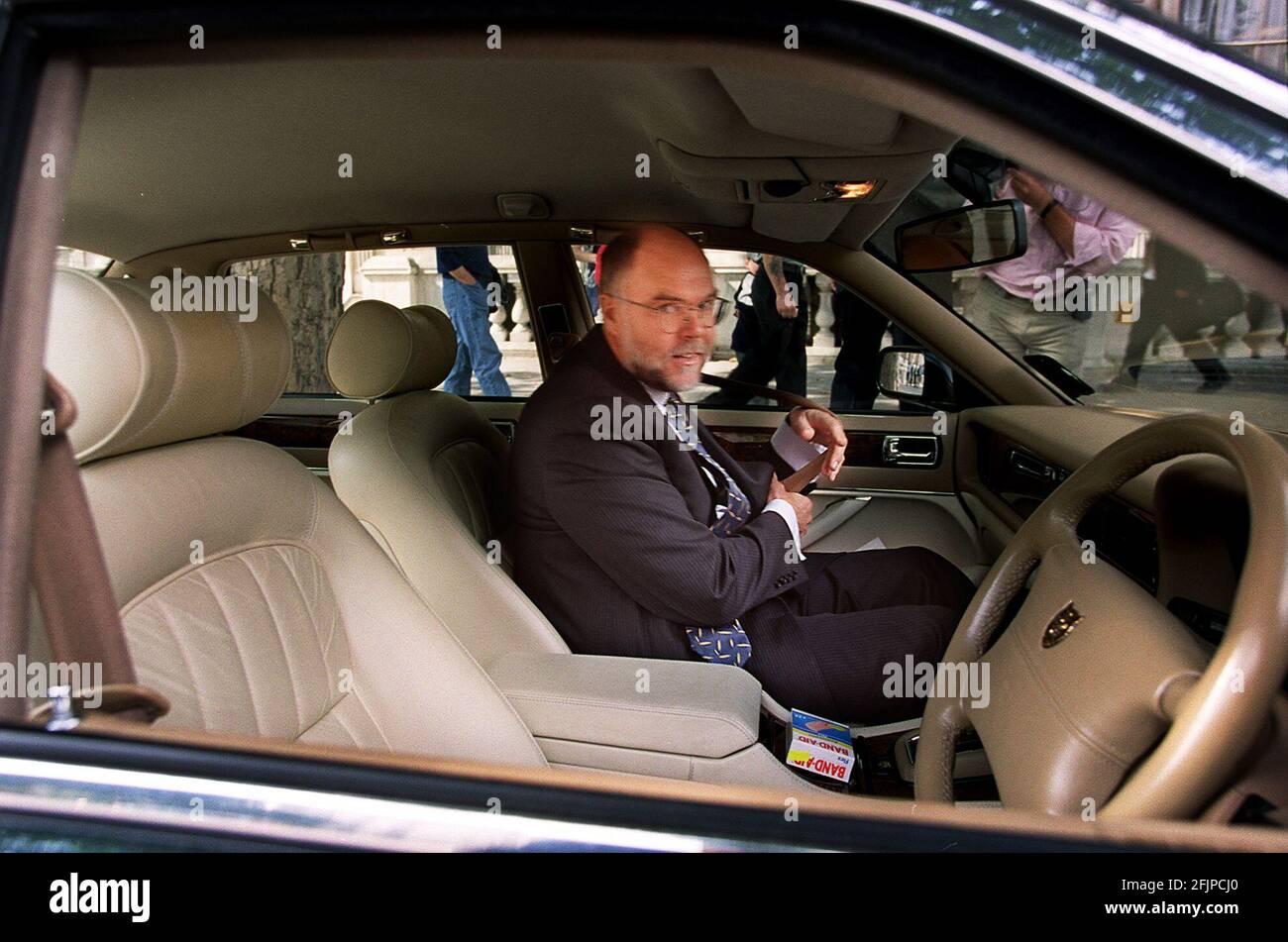 Shell Chief Executive Malcolm Brinder prepares to leave in his Jaguar ...