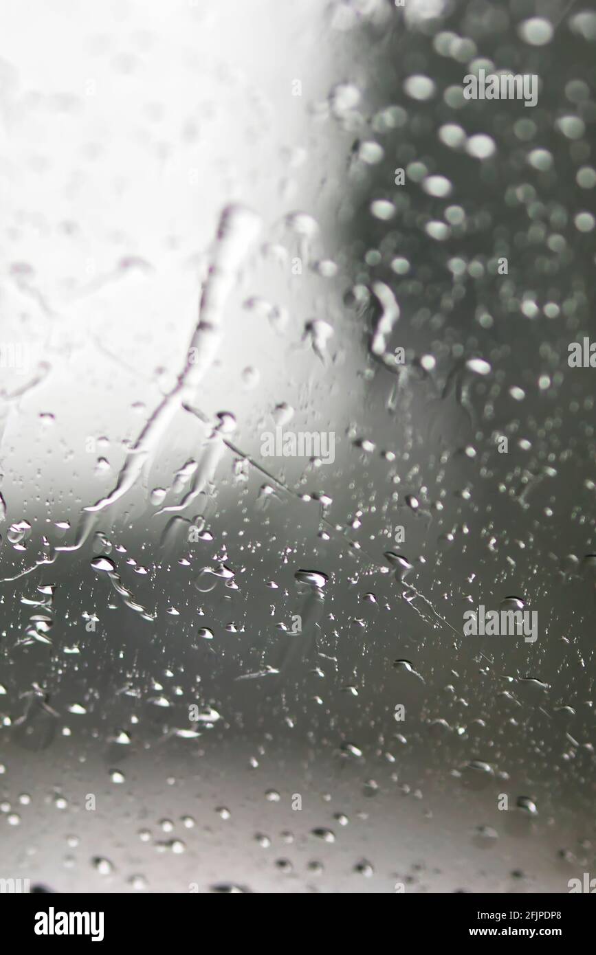 water dropplets streaming down window in rain Stock Photo - Alamy