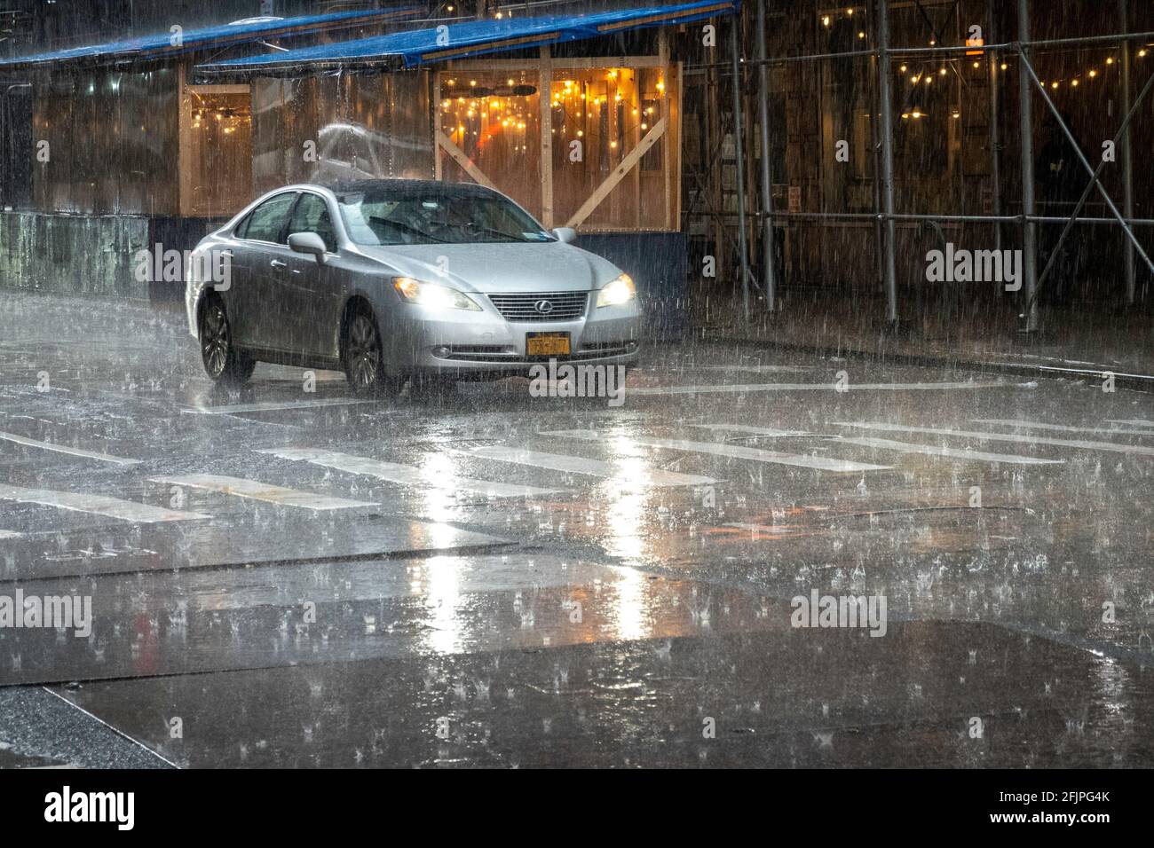 Traffic in Midtown Manhattan During a Violet Spring Rainstorm, NYC, USA ...