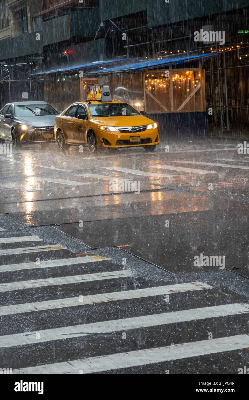 Traffic in Midtown Manhattan During a Violet Spring Rainstorm, NYC, USA ...