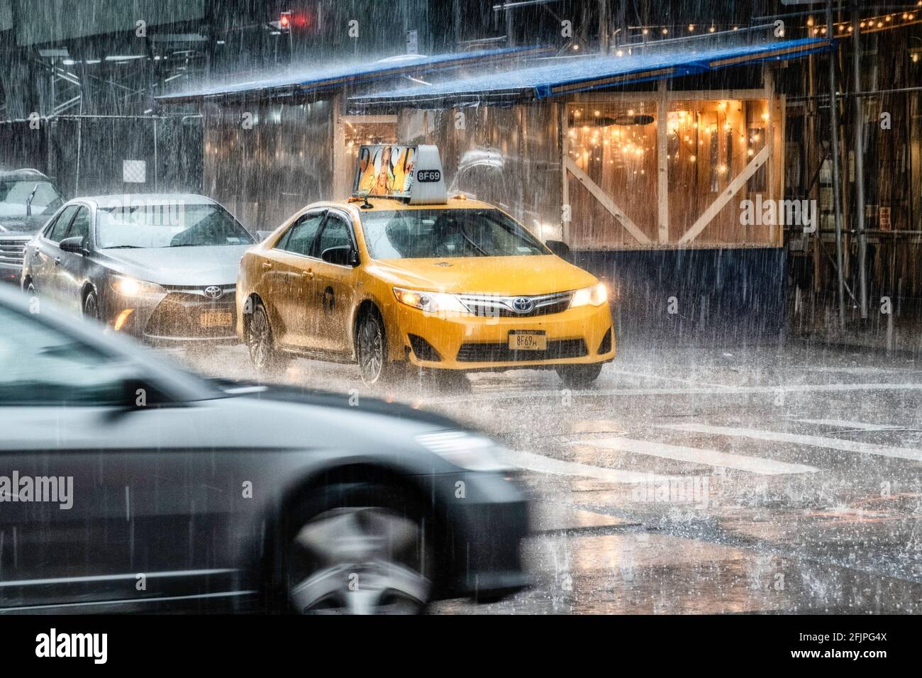 Traffic in Midtown Manhattan During a Violet Spring Rainstorm, NYC, USA ...