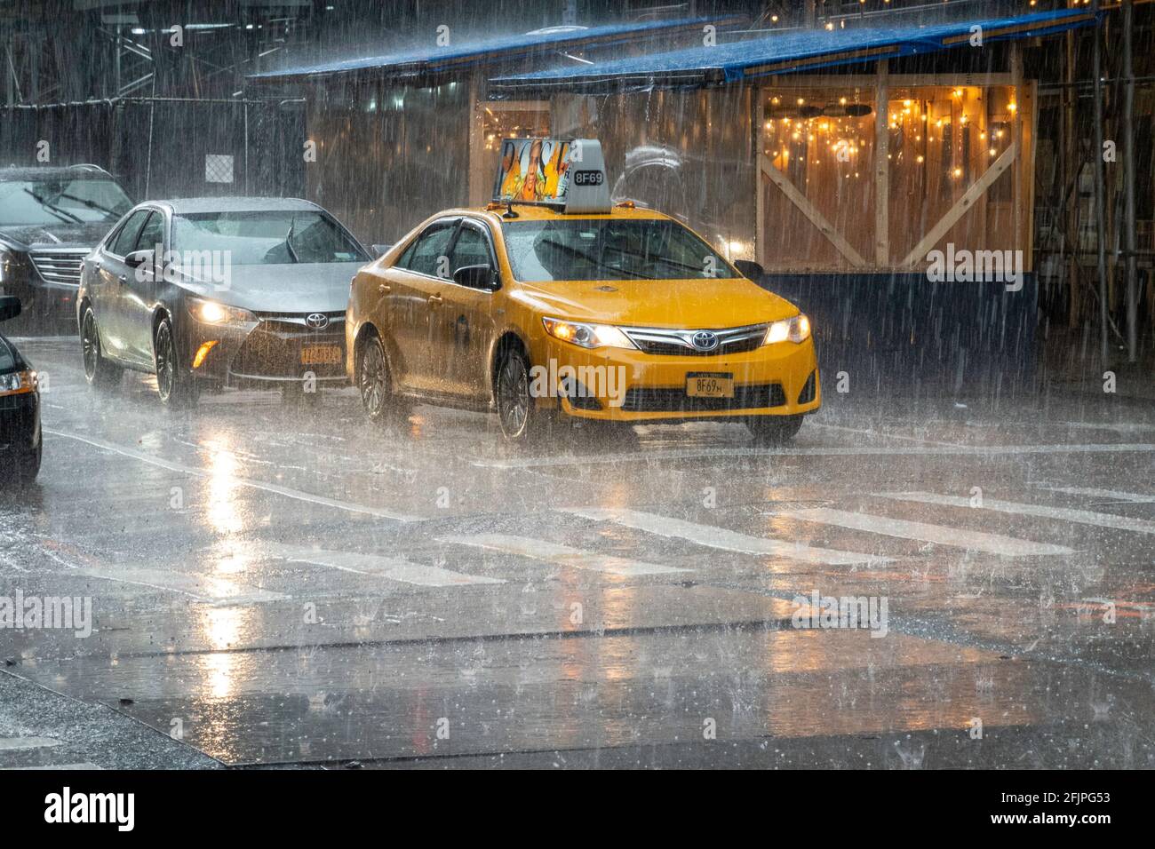 Traffic in Midtown Manhattan During a Violet Spring Rainstorm, NYC, USA ...