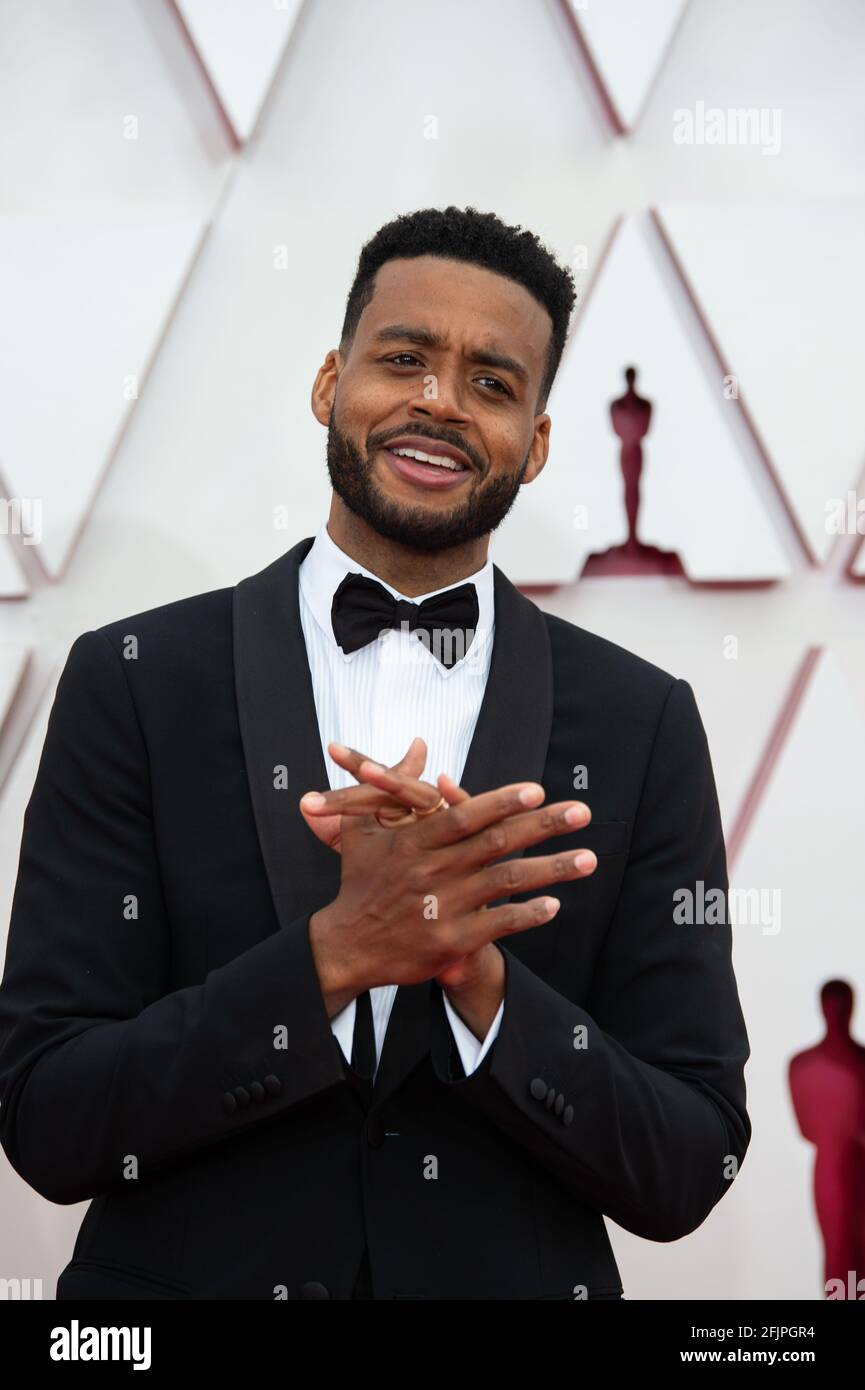 Los Angeles, USA. 25th Apr, 2021. Oscar® nominee Kris Bowers (R) arrives on the red carpet of ...