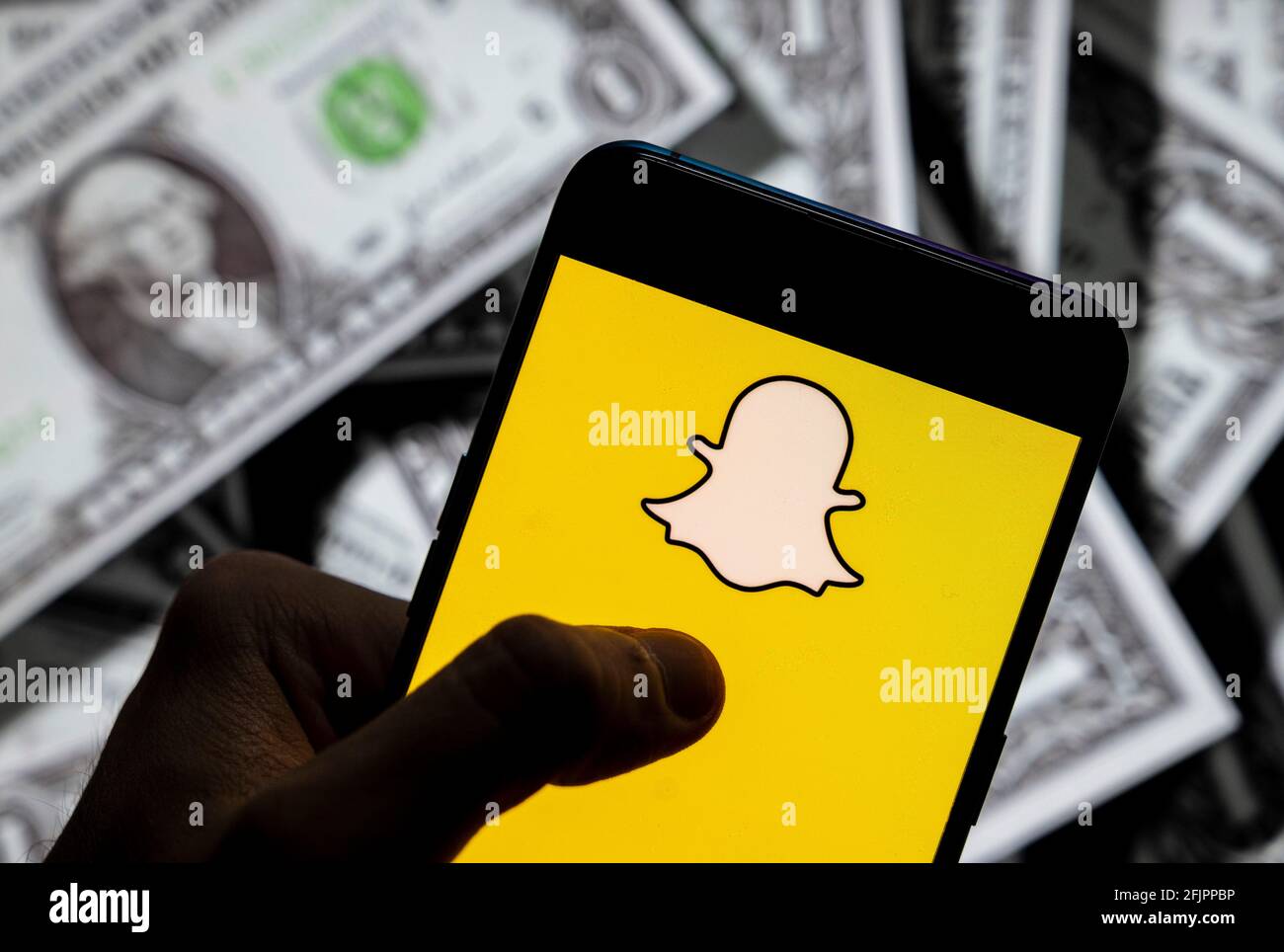 In this photo illustration, a SnapChat logo seen displayed on a ...