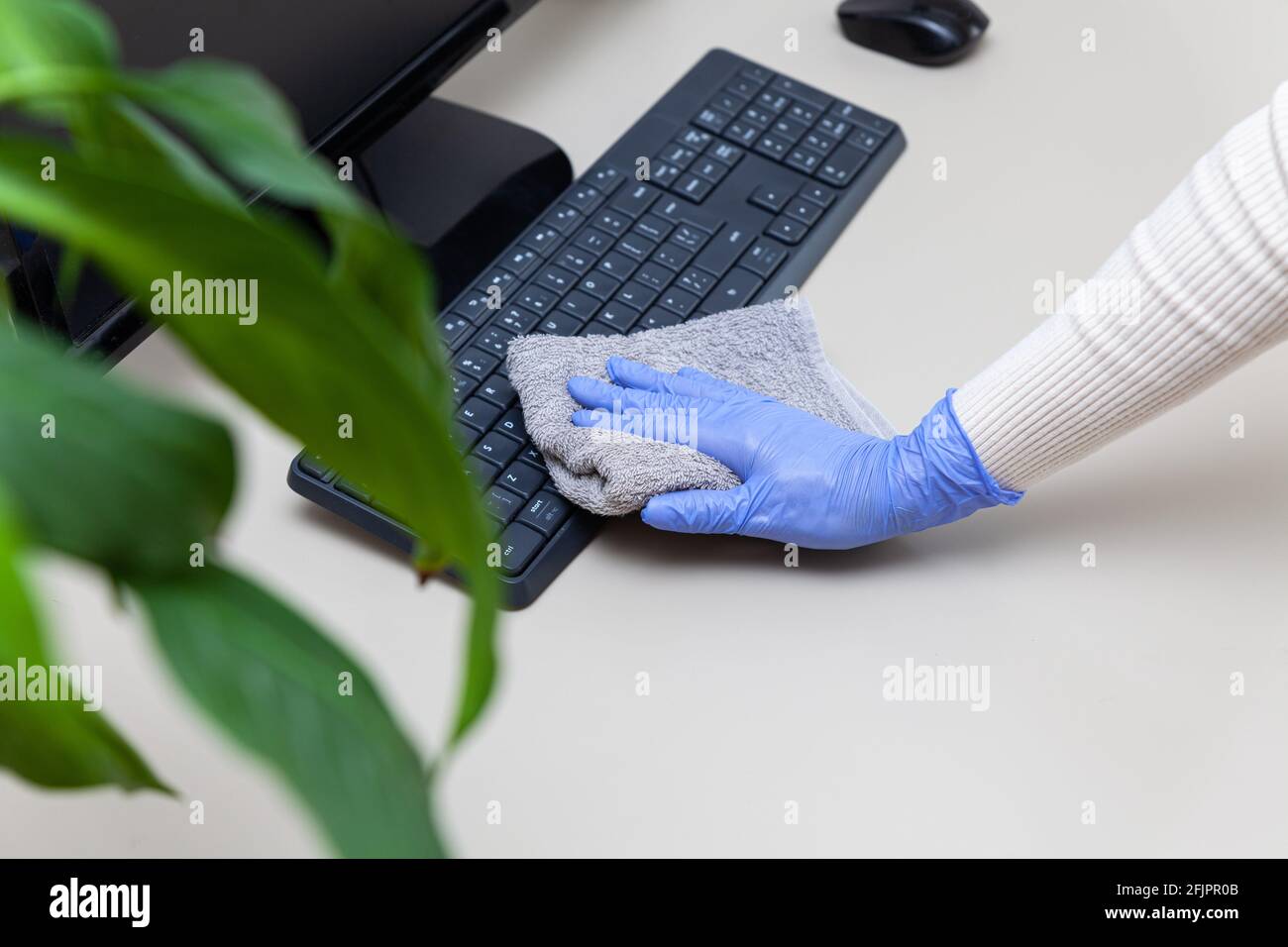 Disinfecting computer, antibacterial spray, rag, safe working from home ...