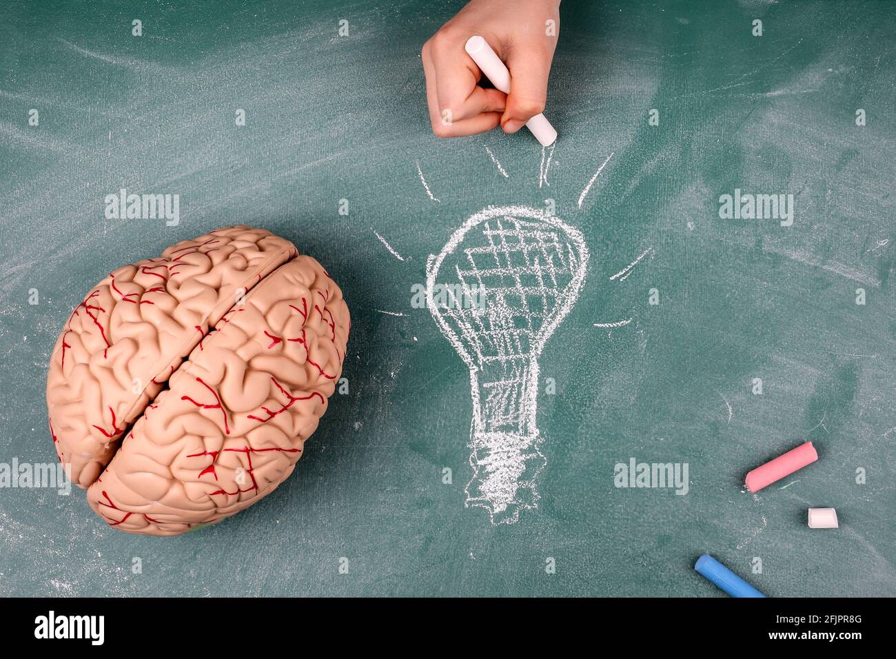 Skills, Education, Idea and creativity concept. The child draws with ...