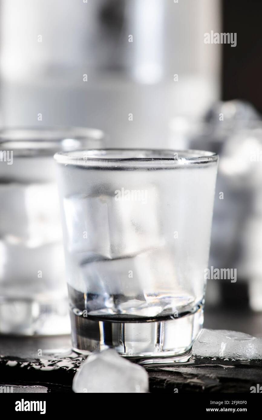 Cold Vodka in shot glasses on black background, ready to drink Stock ...