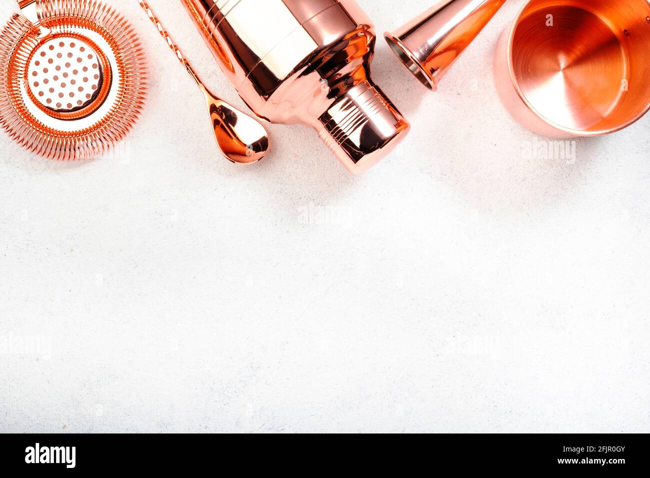 Set of copper bar tools for making cocktails, white background, top ...