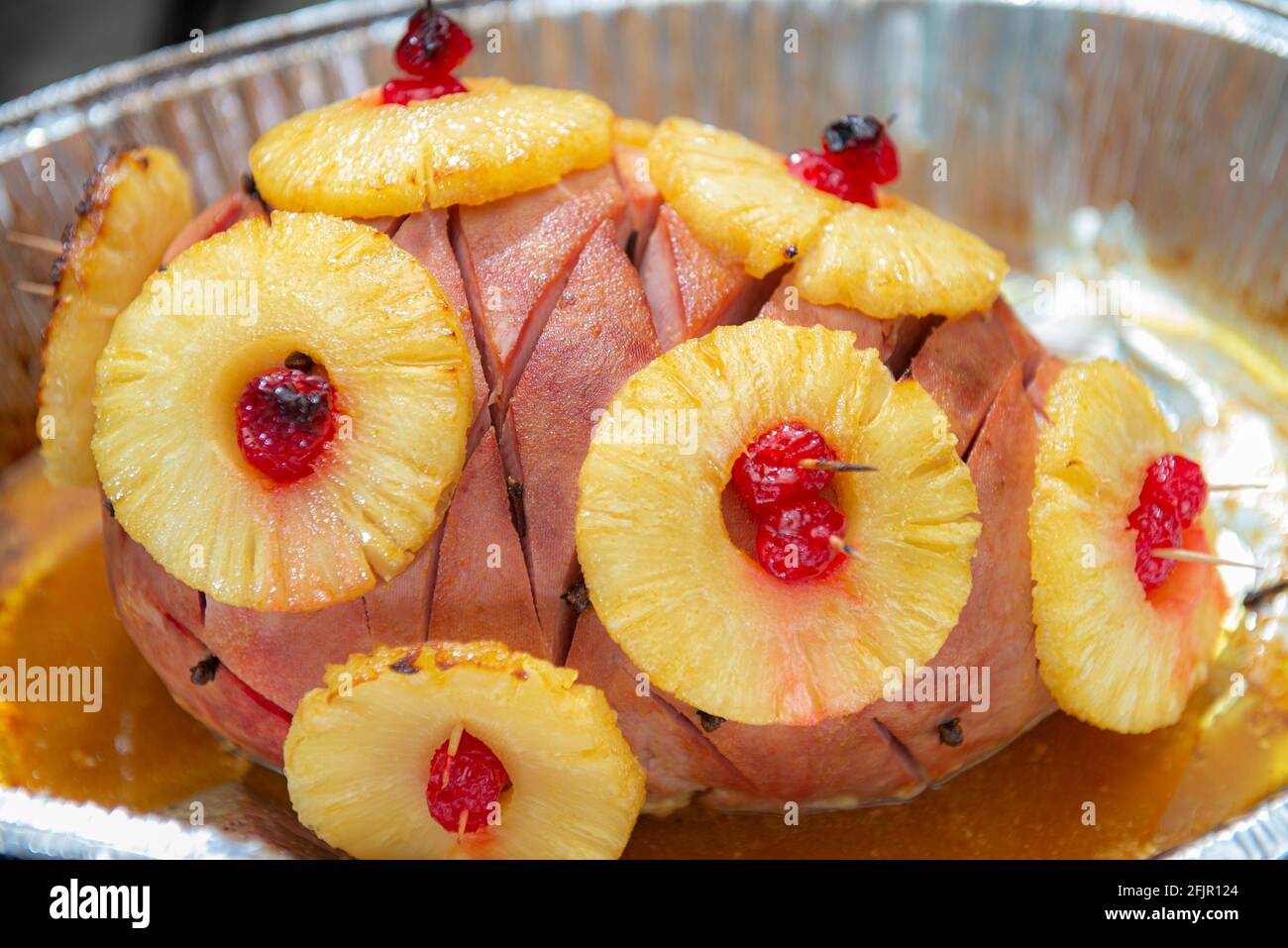 Christmas dinner with baked ham with pineapple slices and cherries on ...