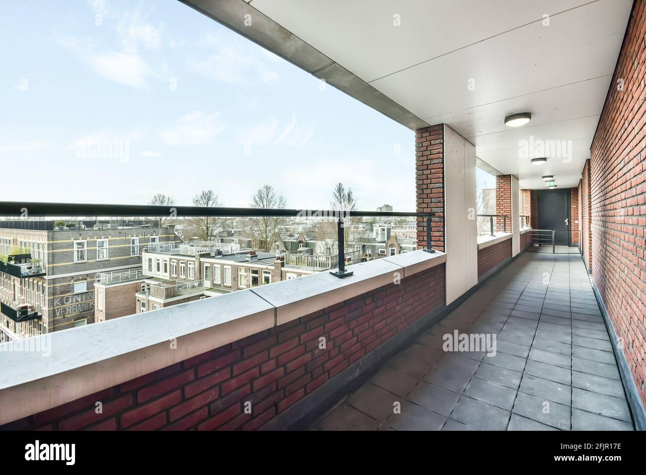 Balcony of residential brick building Stock Photo - Alamy