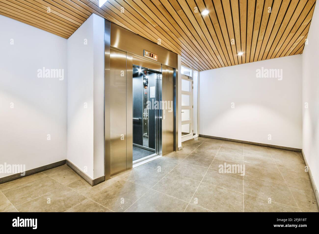 Modern elevator in apartment building hall Stock Photo - Alamy